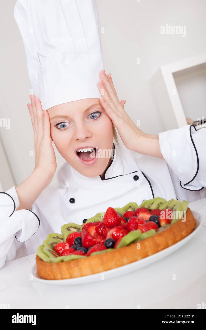Beautiful chef woman making cake Stock Photo - Alamy