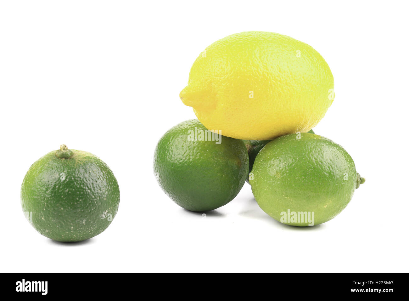 Fresh lime and lemon isolated on white Stock Photo - Alamy