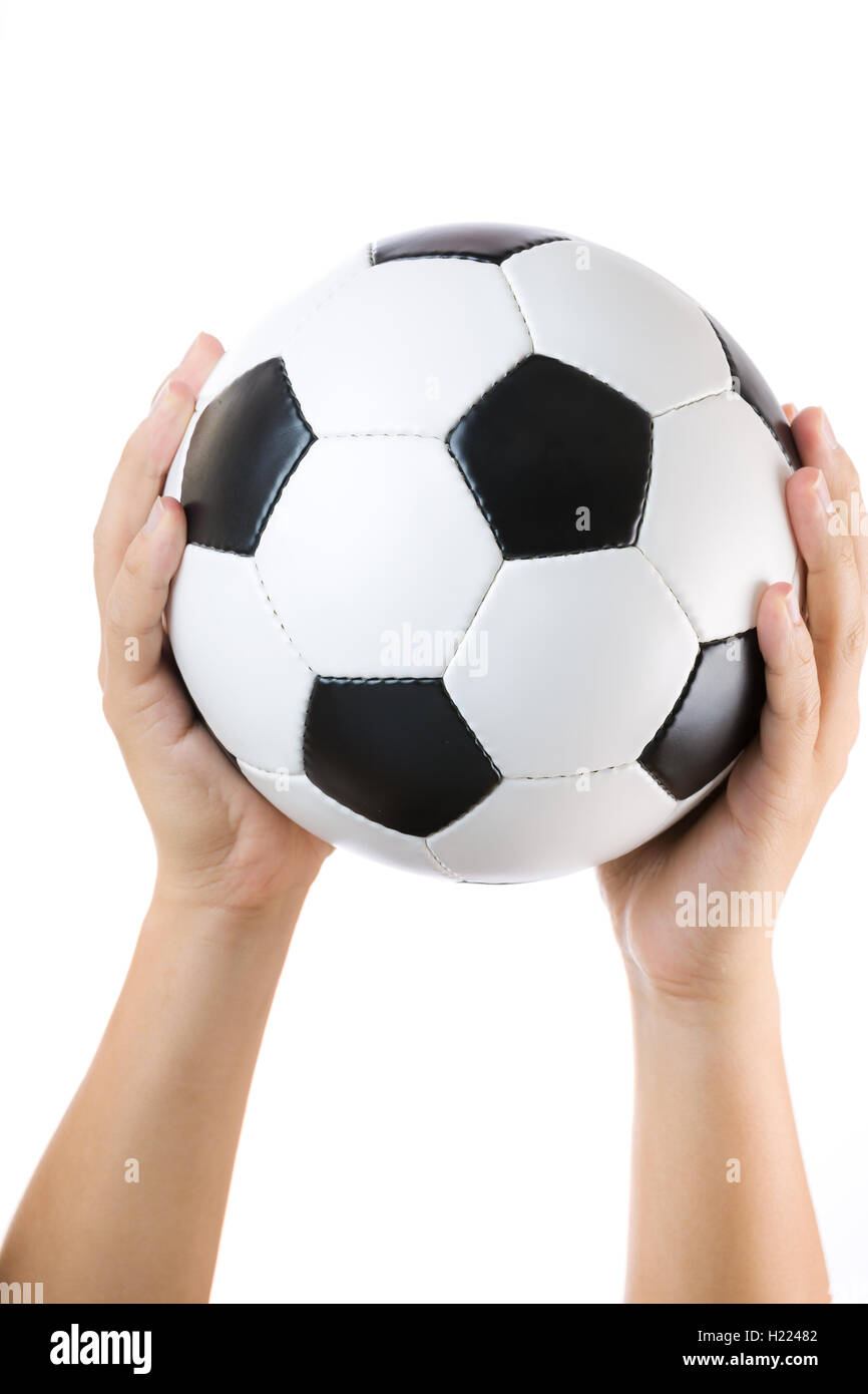 Soccer ball raised by hand Stock Photo - Alamy