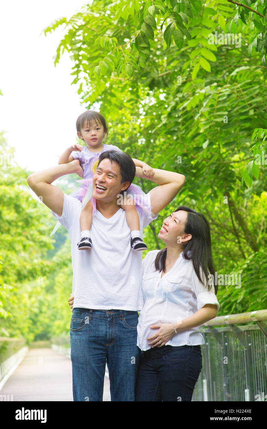 Happy Asian family outdoor fun Stock Photo - Alamy