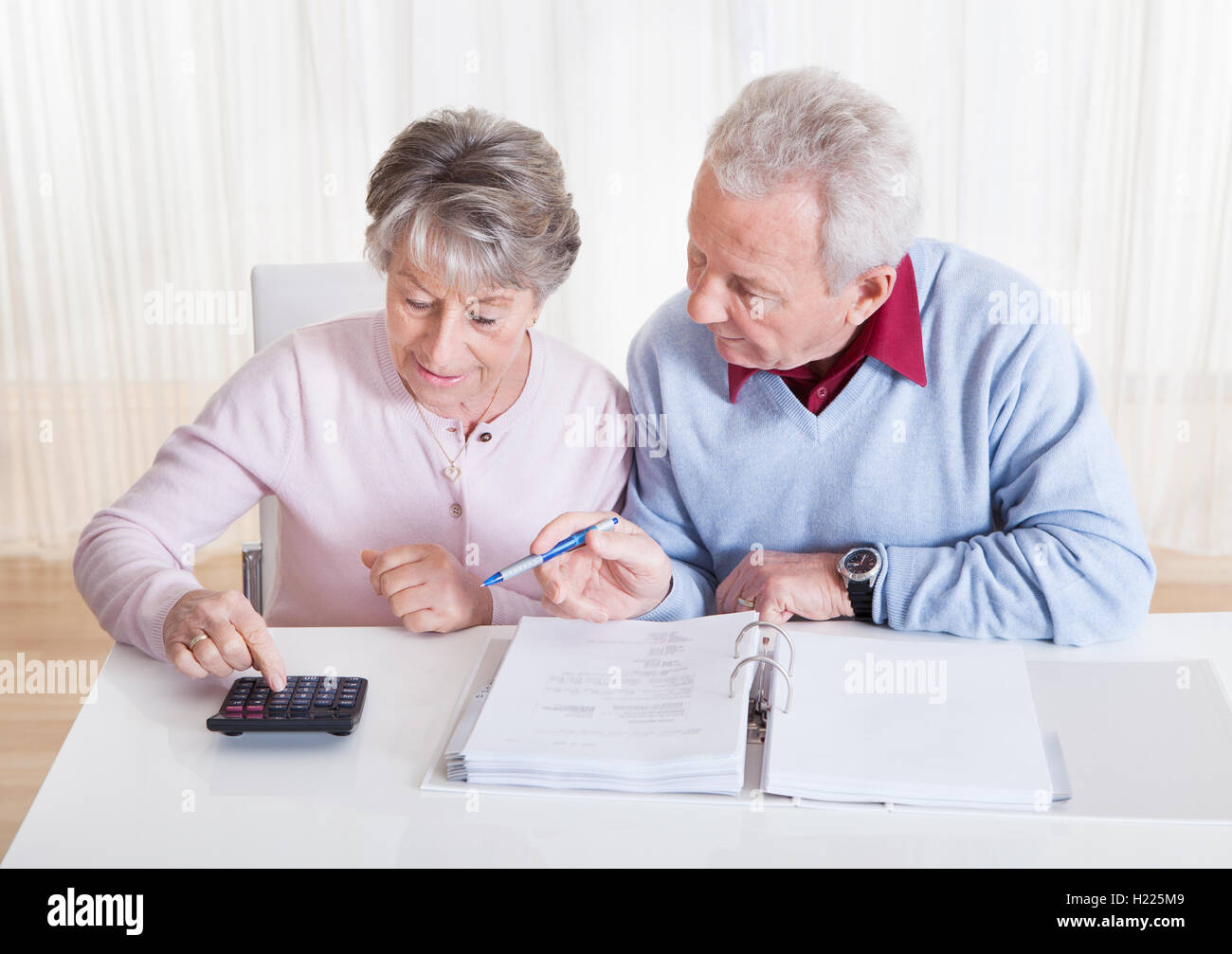 Senior Couple Calculating Budget Stock Photo - Alamy