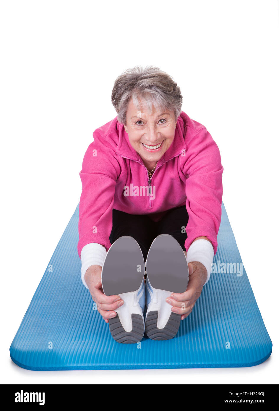 Senior Woman Stretching Her Legs Stock Photo - Alamy