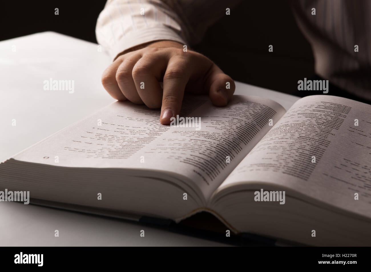 man is looking for information in the directory Stock Photo - Alamy