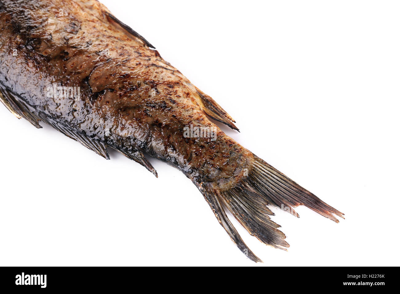 The tail of fried fish Stock Photo - Alamy