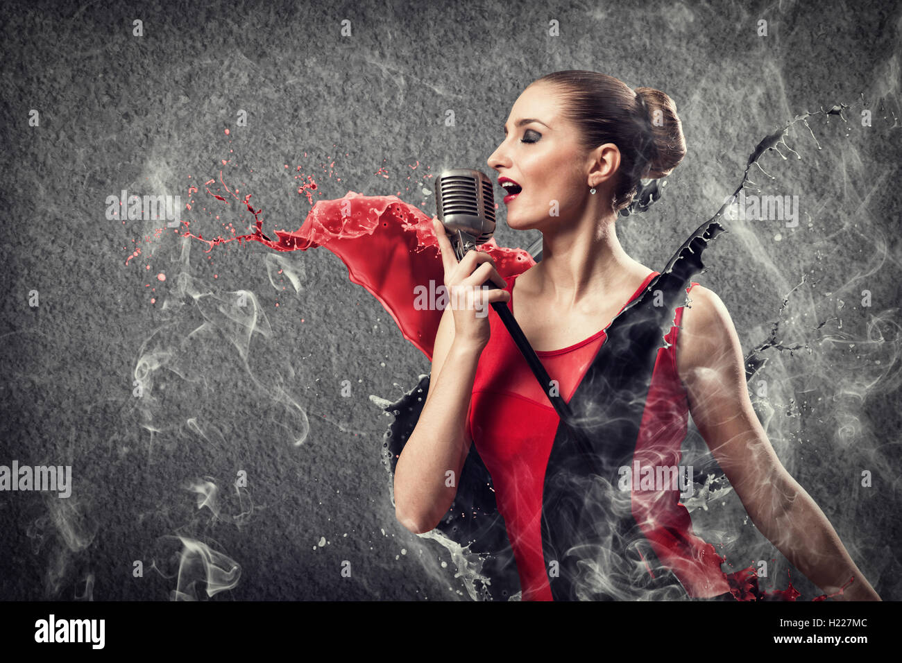 attractive female singer with microphone Stock Photo - Alamy