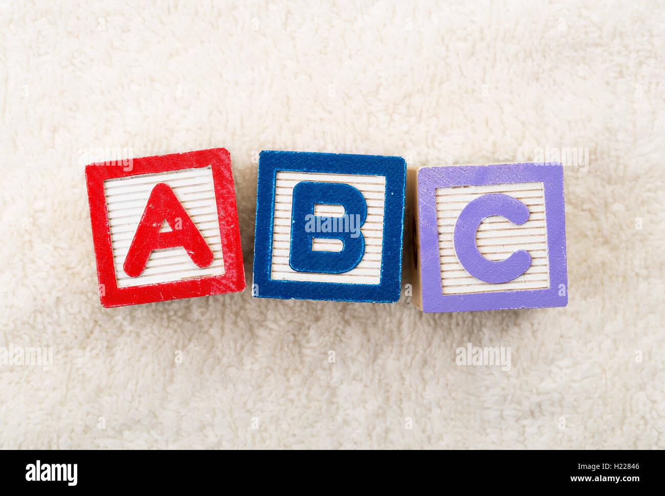 ABC toy block with towel background Stock Photo - Alamy