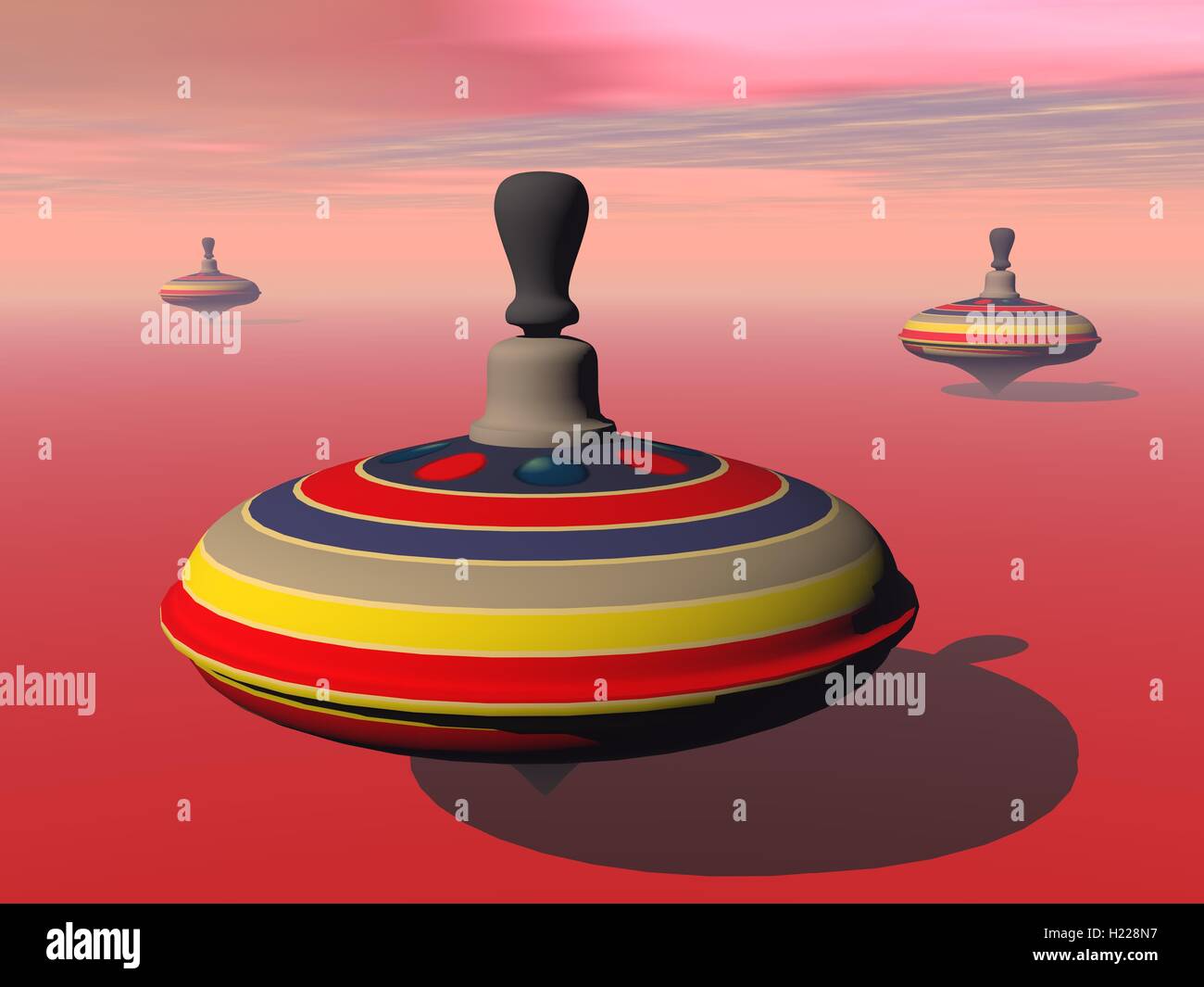 Spinning tops - 3D render Stock Photo - Alamy