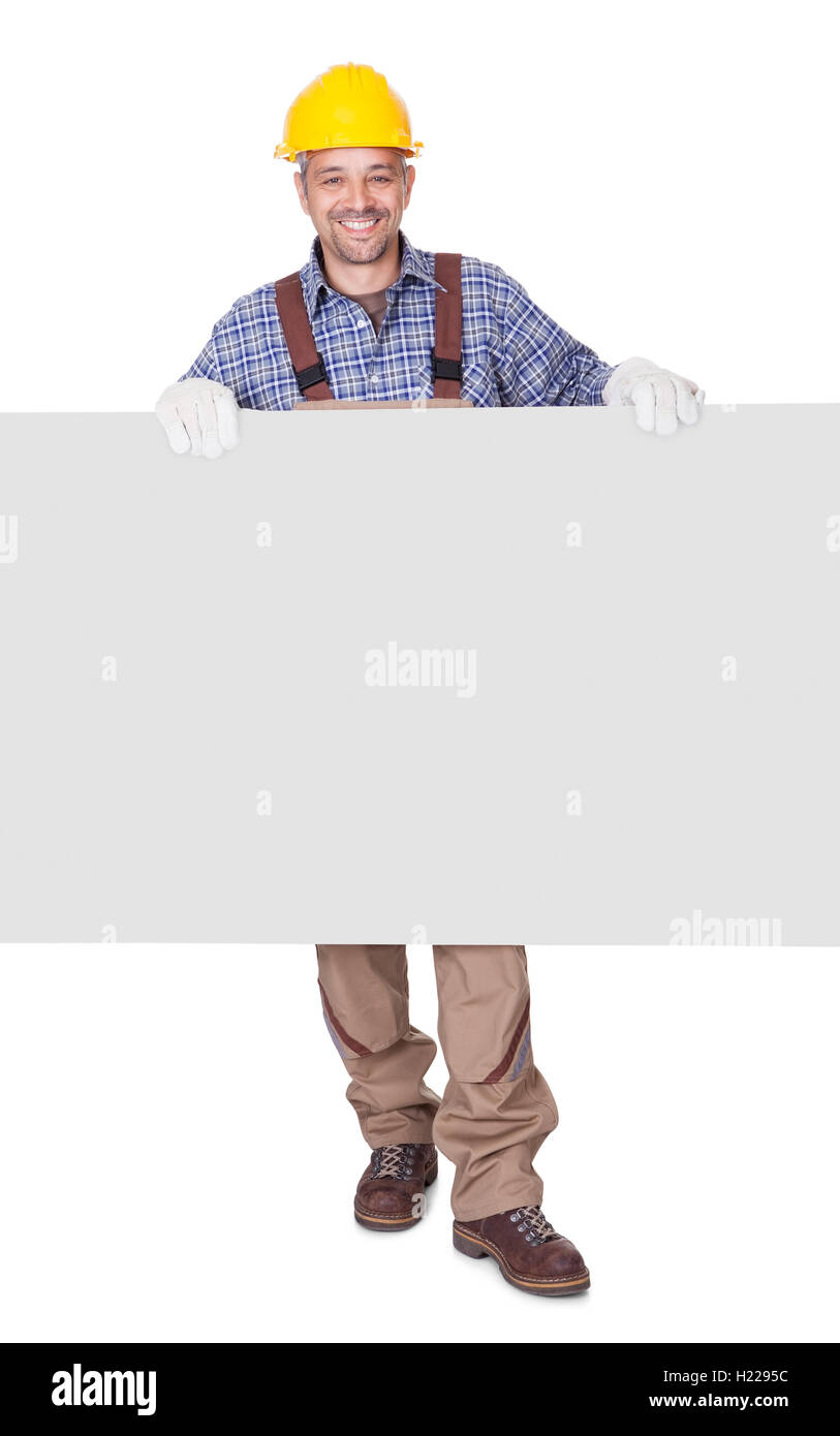 Portrait Of Happy Contractor Holding Placard Stock Photo - Alamy