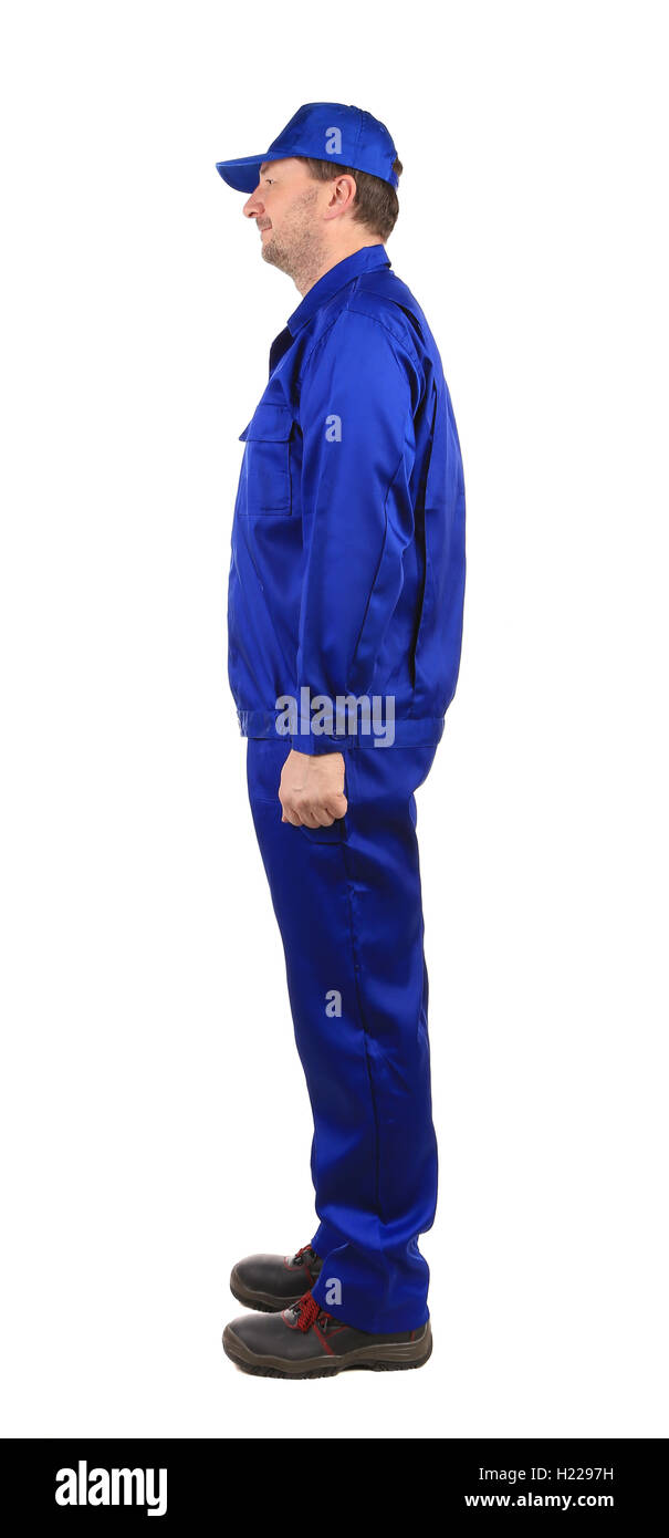 Worker in blue workwear. Side view Stock Photo - Alamy