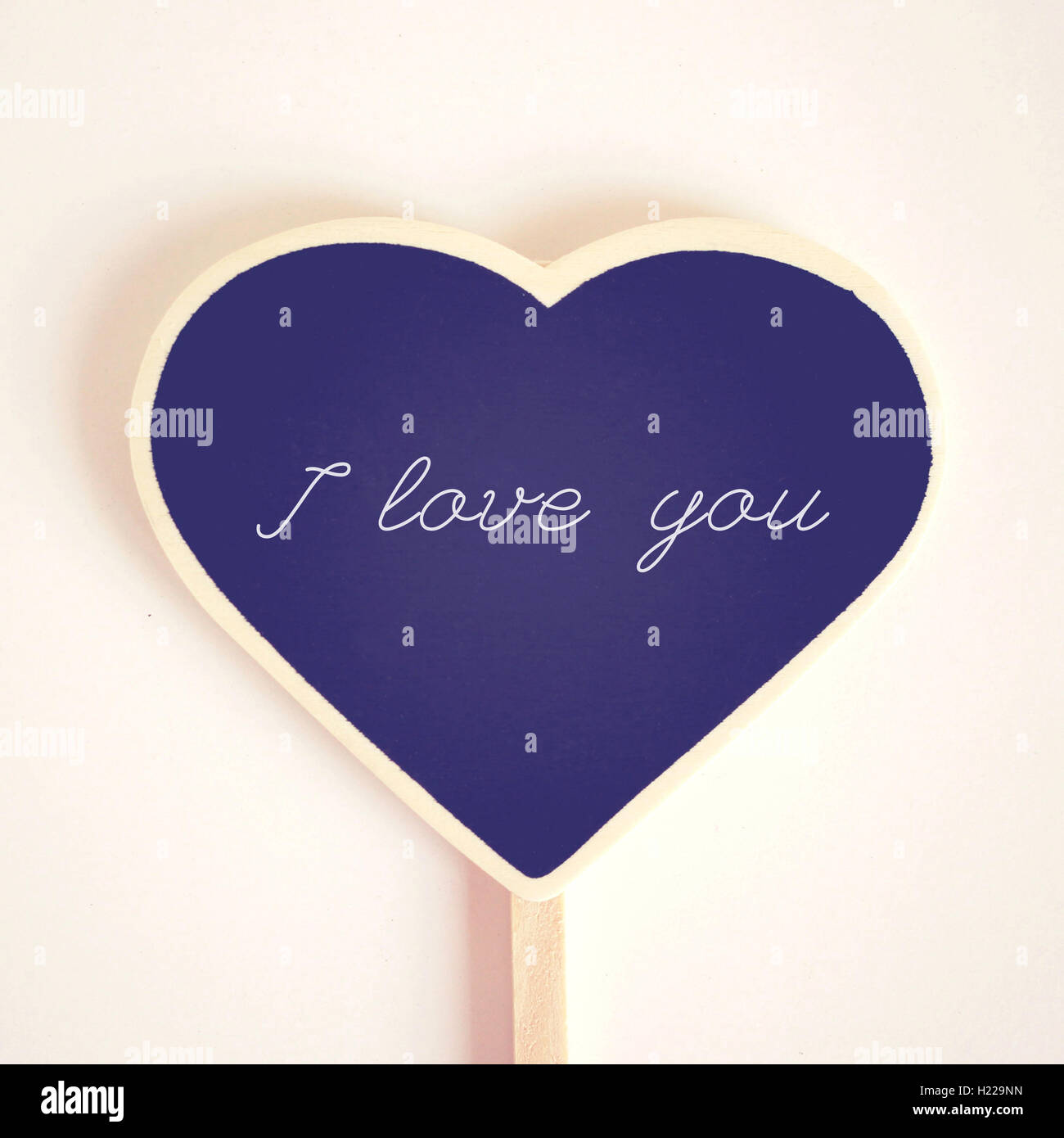 I love you word on heart shaped blackboard, retro filter effect Stock ...