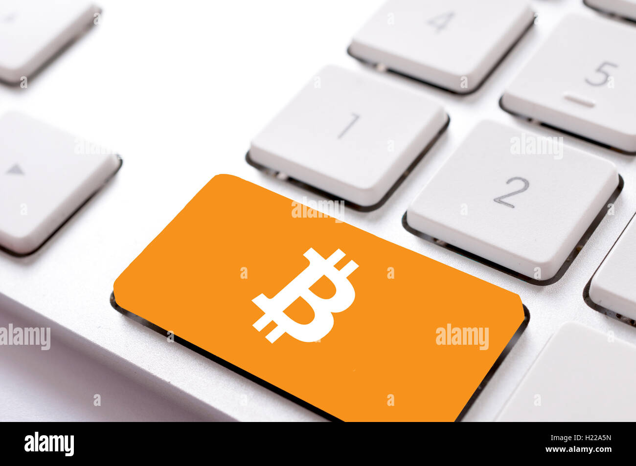 Bitcoin on keyboard Stock Photo - Alamy