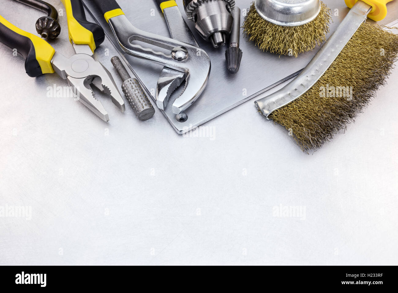 set of hand tools for house renovation on scratched metal background ...