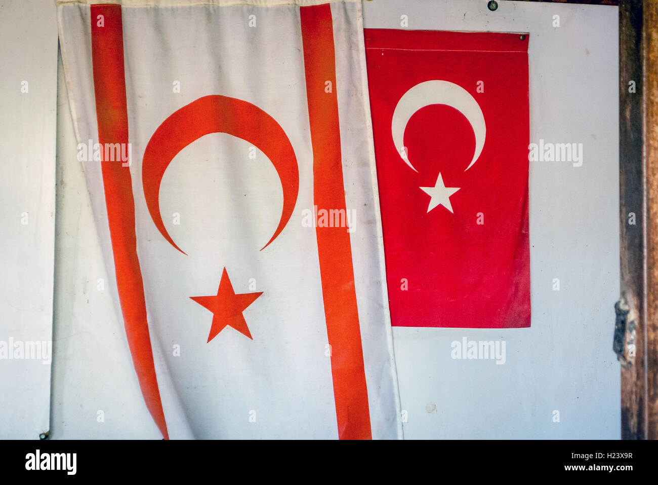 Flags of the Turkish republic of Northern Cyprus, left, and Turkey ...