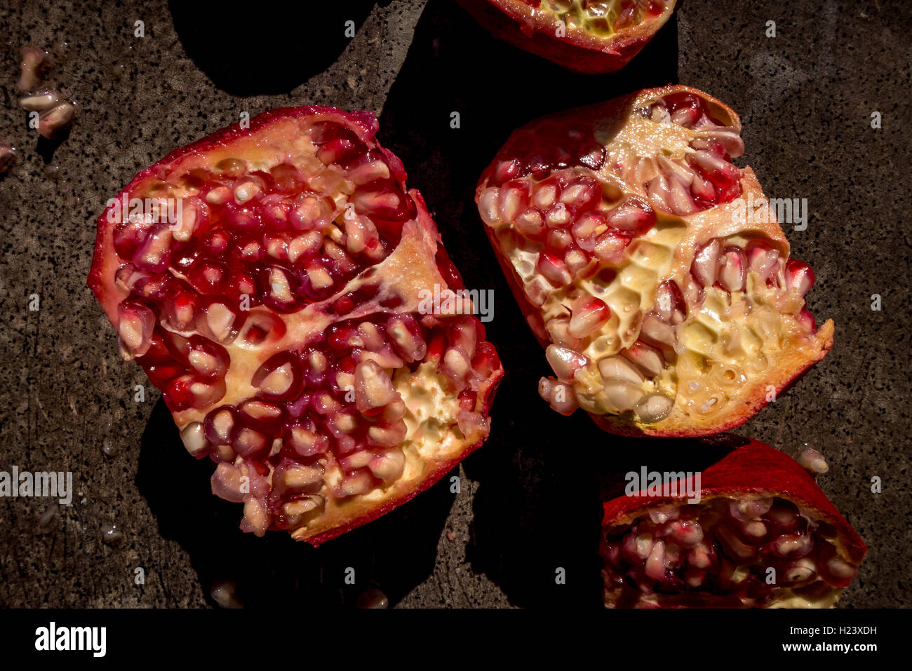 A pomegranate sliced open Stock Photo - Alamy