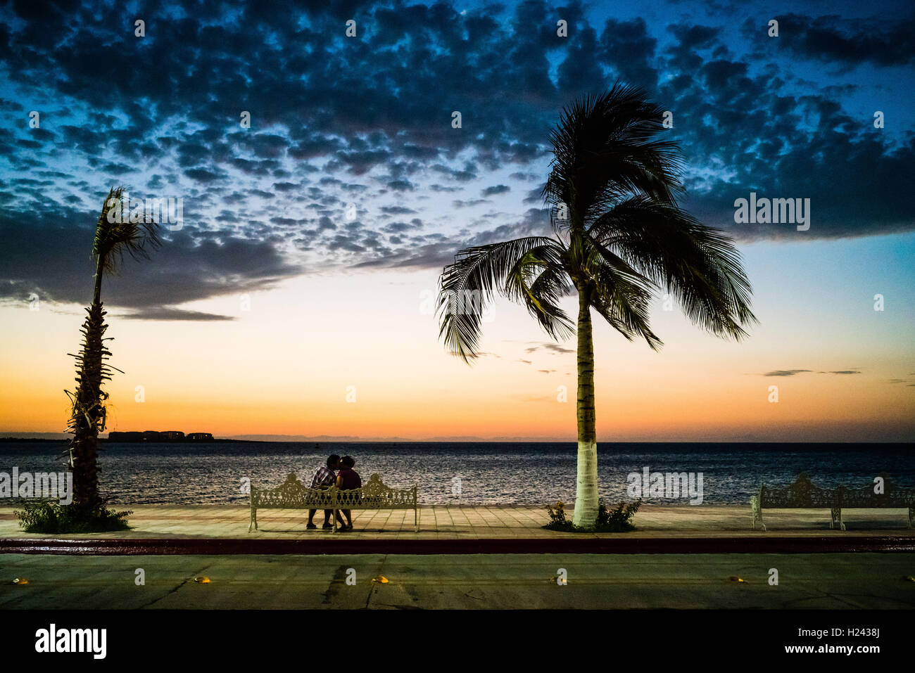 Waterfront at sunset Stock Photo - Alamy