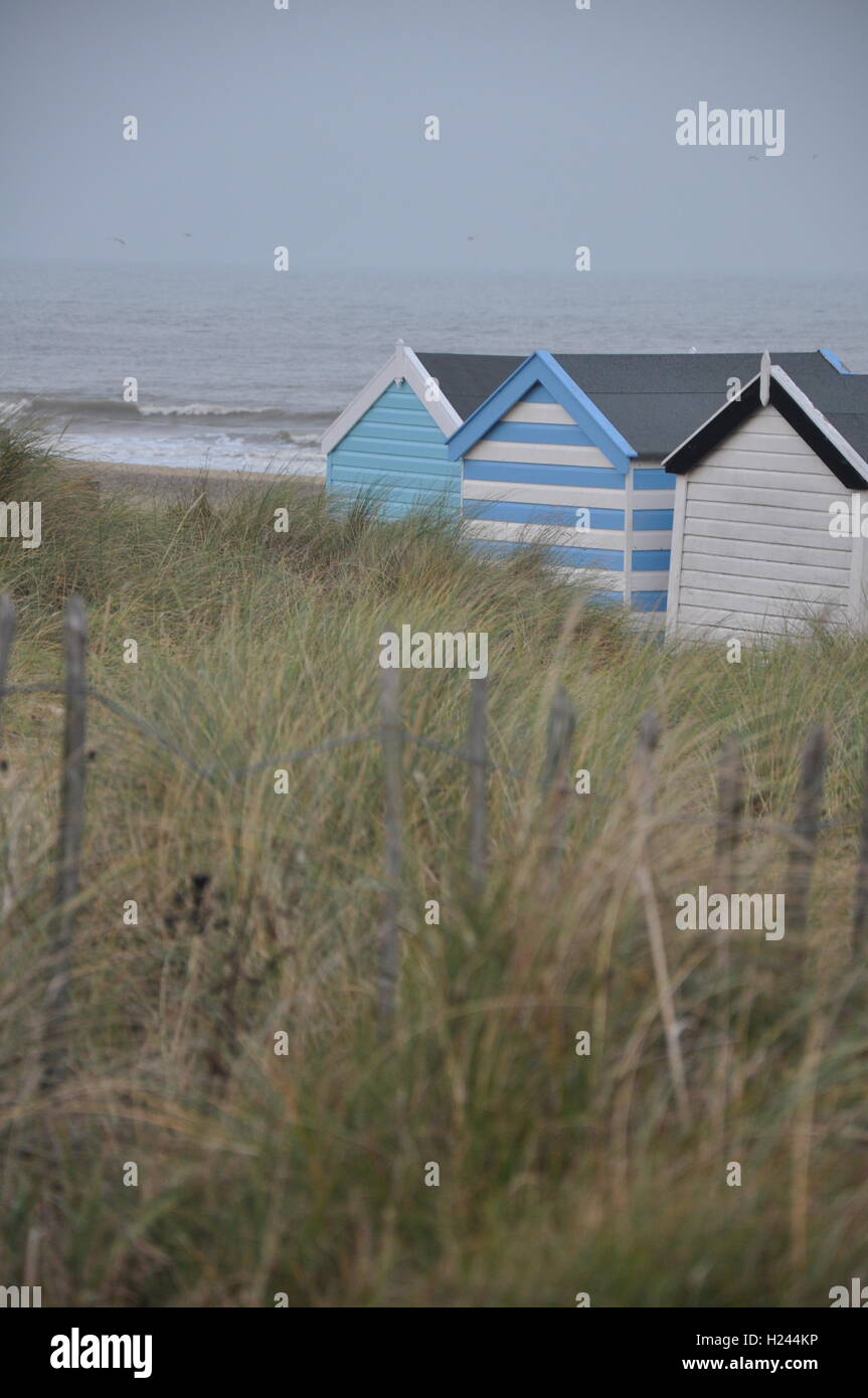 Three beach huts in dunes Stock Photo - Alamy