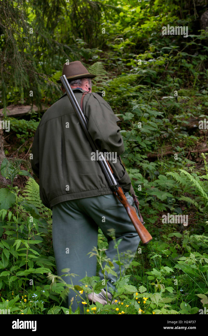 An old hunter walks in Romanian mountains Stock Photo - Alamy