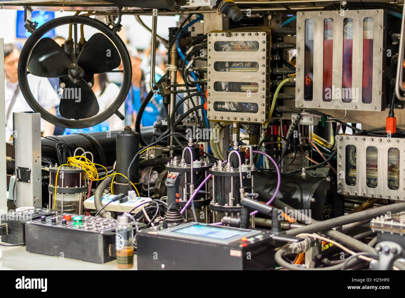 Messy electronics with wires, panels, connectors, devices everywhere ...