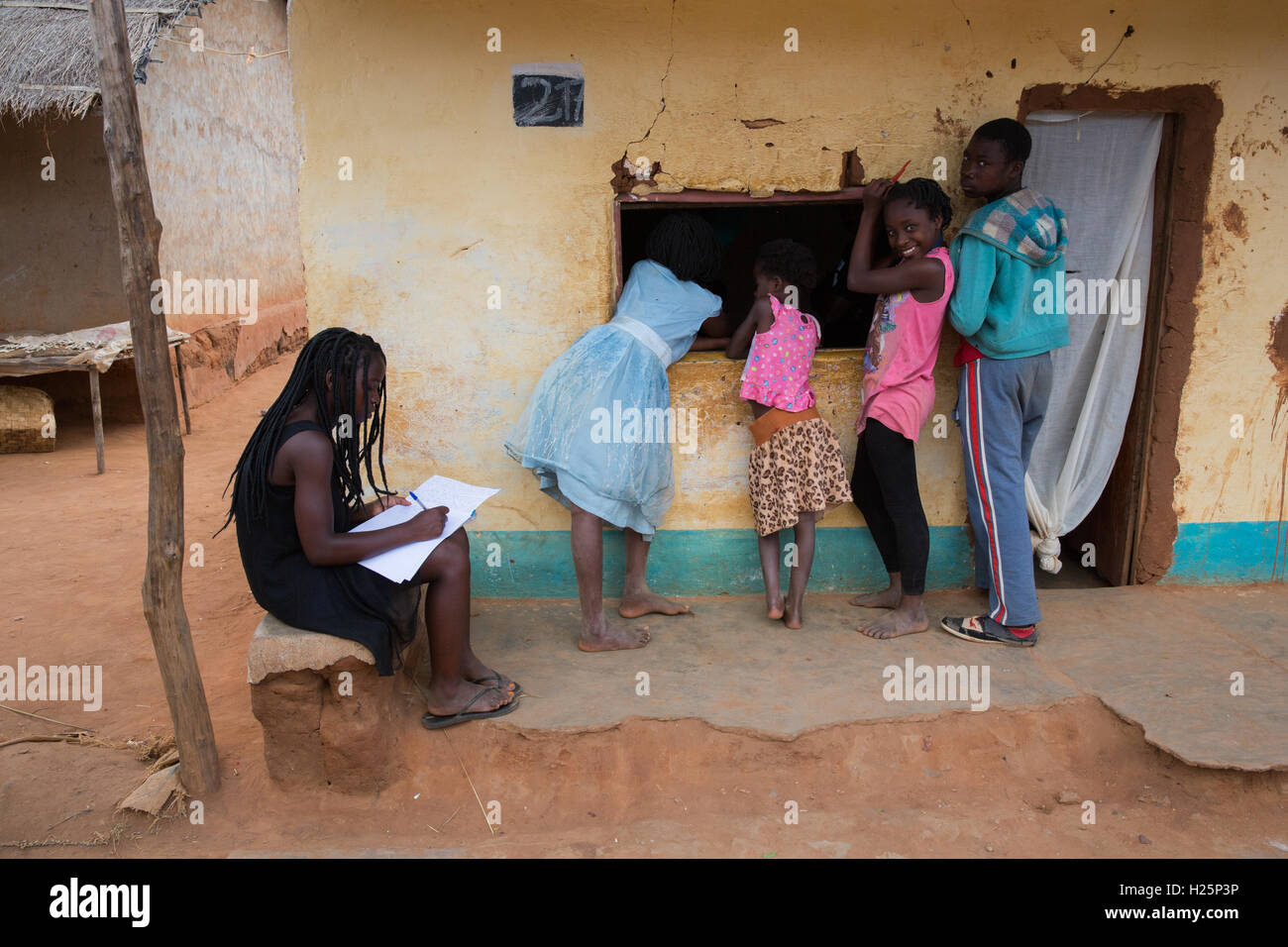 Children queue for school hi-res stock photography and images - Alamy