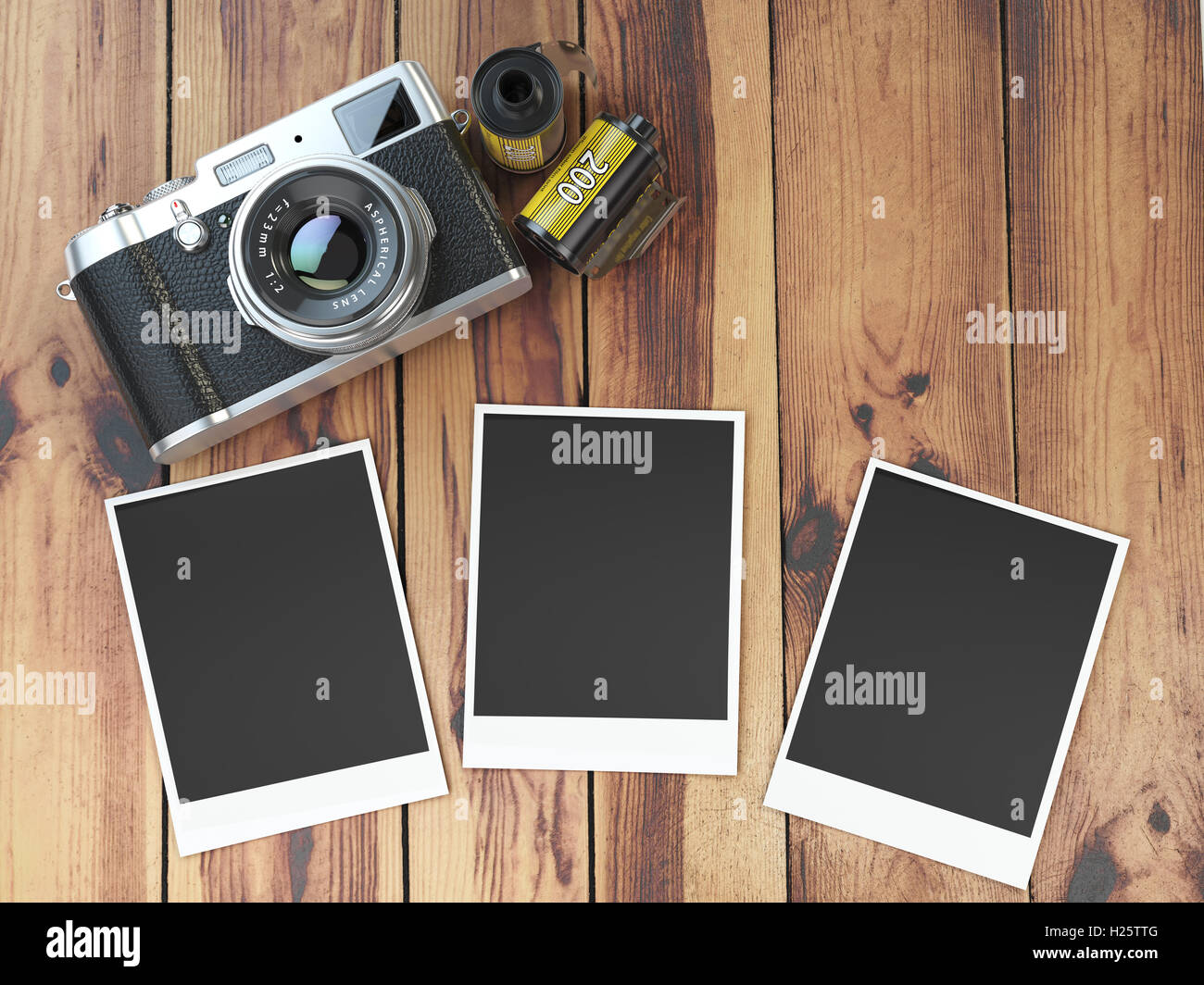 Retro camera, empty photo frames pictures and film canisterrs on wood ...