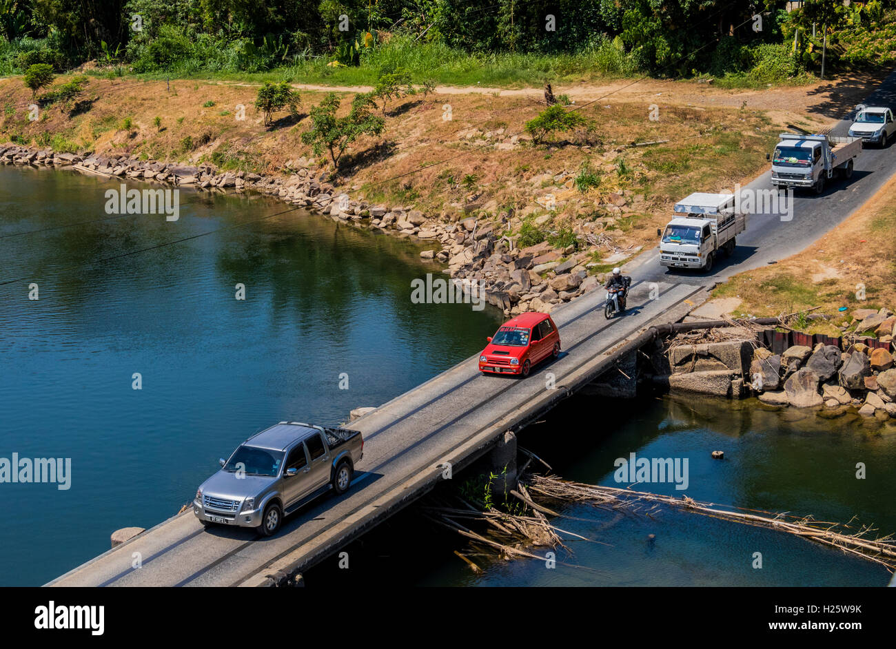 Car going across bridge to Tamperuli market near Tuaran Sabah Malaysia ...