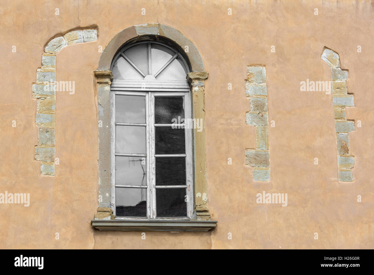 exterior of an old building with arched windows Stock Photo - Alamy