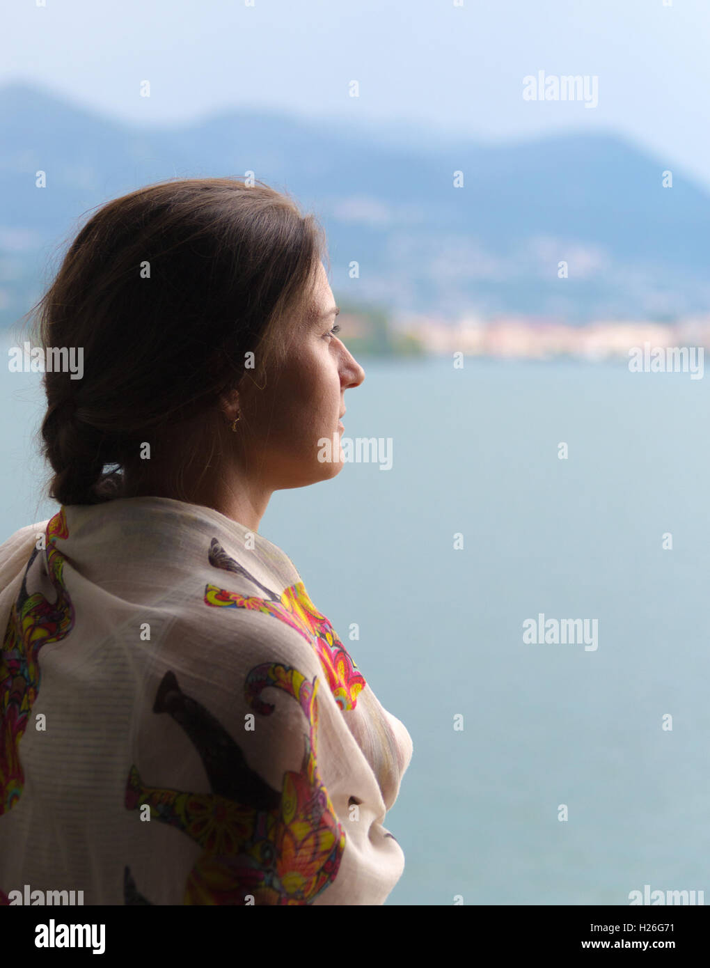 woman looking over Lake Maggiore and the Borromean Islands Stock Photo ...