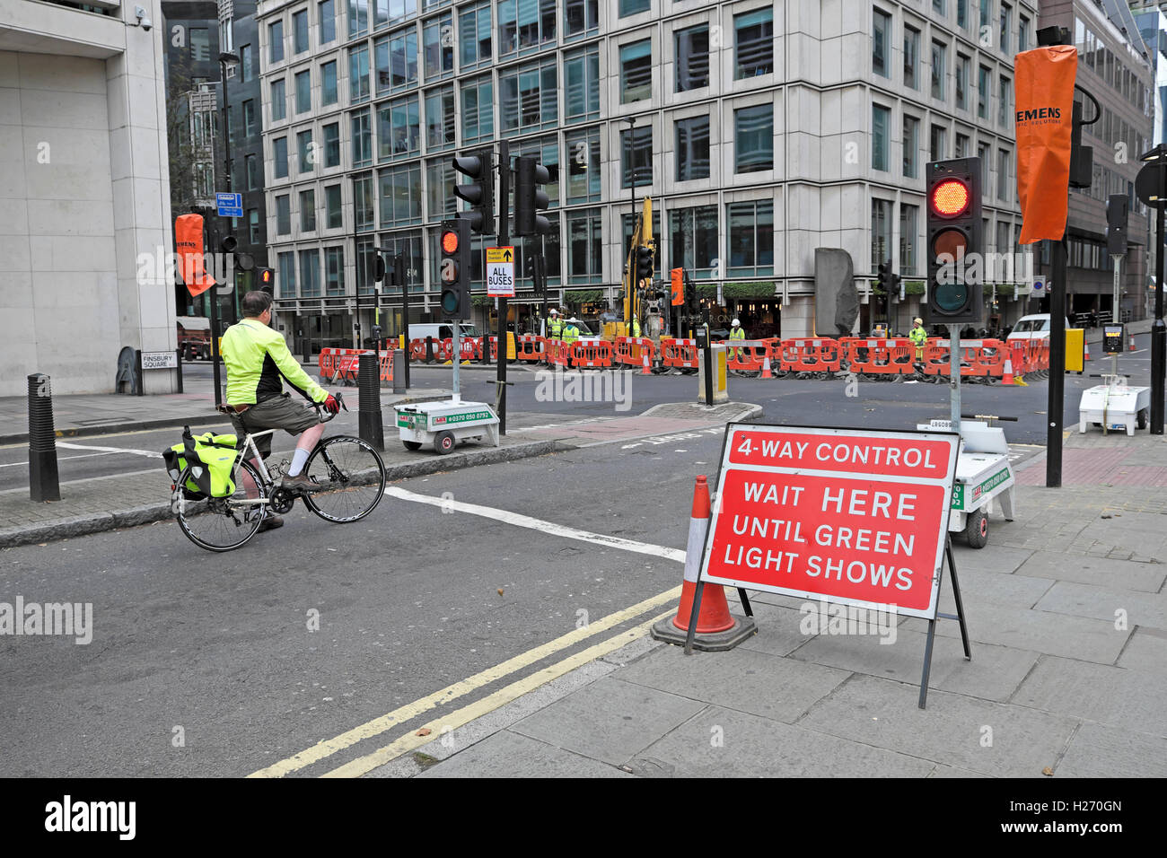 Cyclist and roadworks on the corner of City Road and Finsbury Street in ...