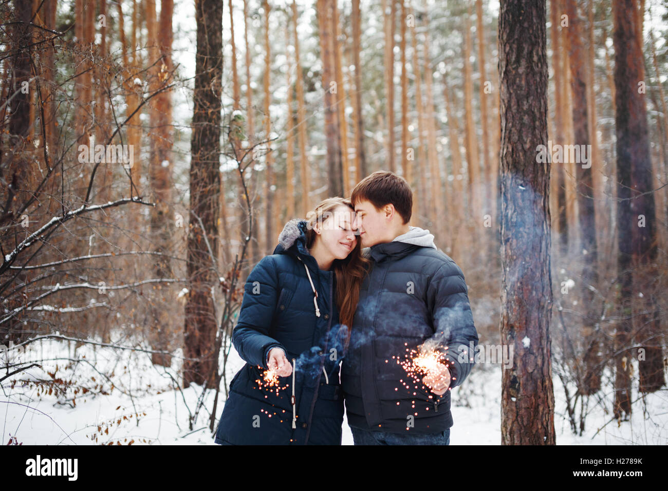 Couple in love having fun in winter holidays. Snow forest Stock Photo ...