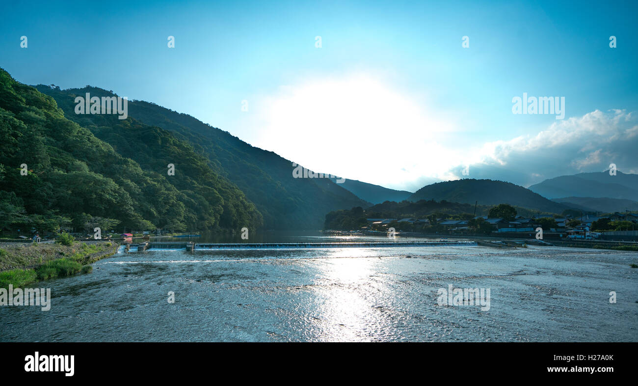 Rolling Mountains and Shimmering River Stock Photo - Alamy