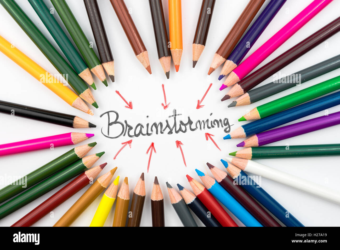Colouring pencils in circle arrangement with message Brainstorming ...