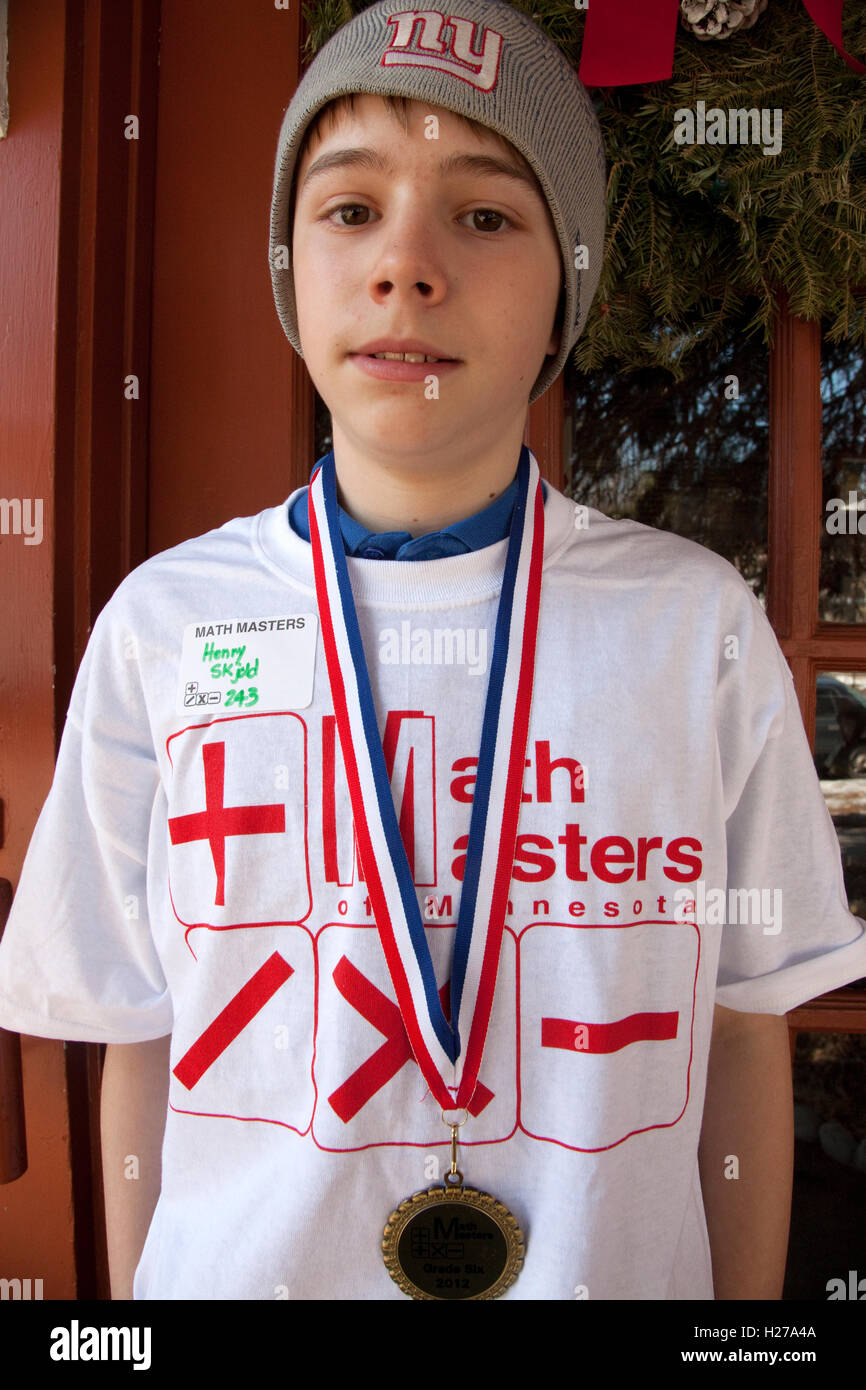 Boy age 12 wearing his Math Masters T-shirt and award medallion St Paul ...