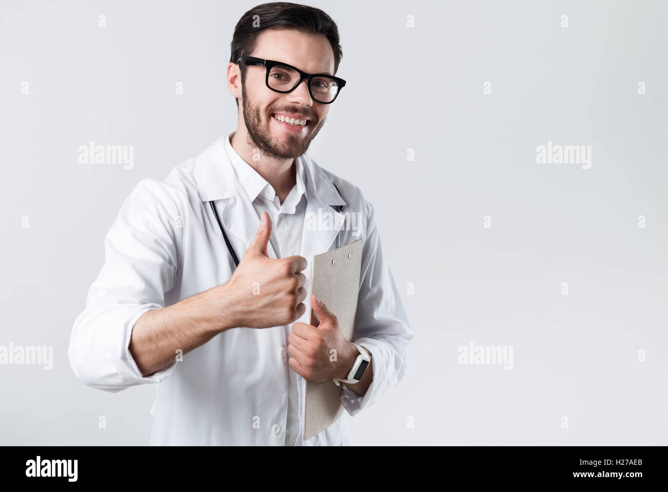 Handsome male doctor putting hi-res stock photography and images - Alamy