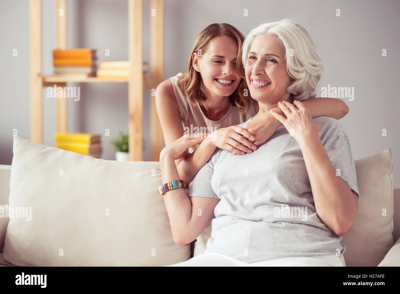 Delighted adult woman embracing her mother Stock Photo - Alamy