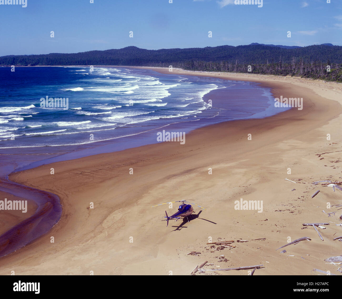 A helicopter from Nimmo Bay Resort drops off guests at Burnett Beach ...
