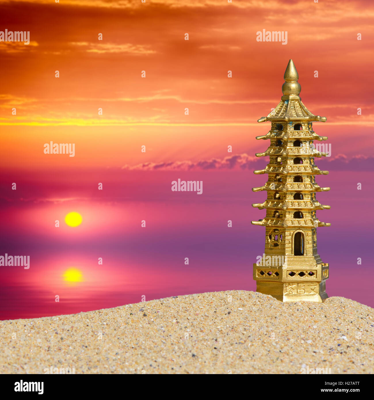 Seven-storied pagoda in the sand at sunrise Stock Photo - Alamy