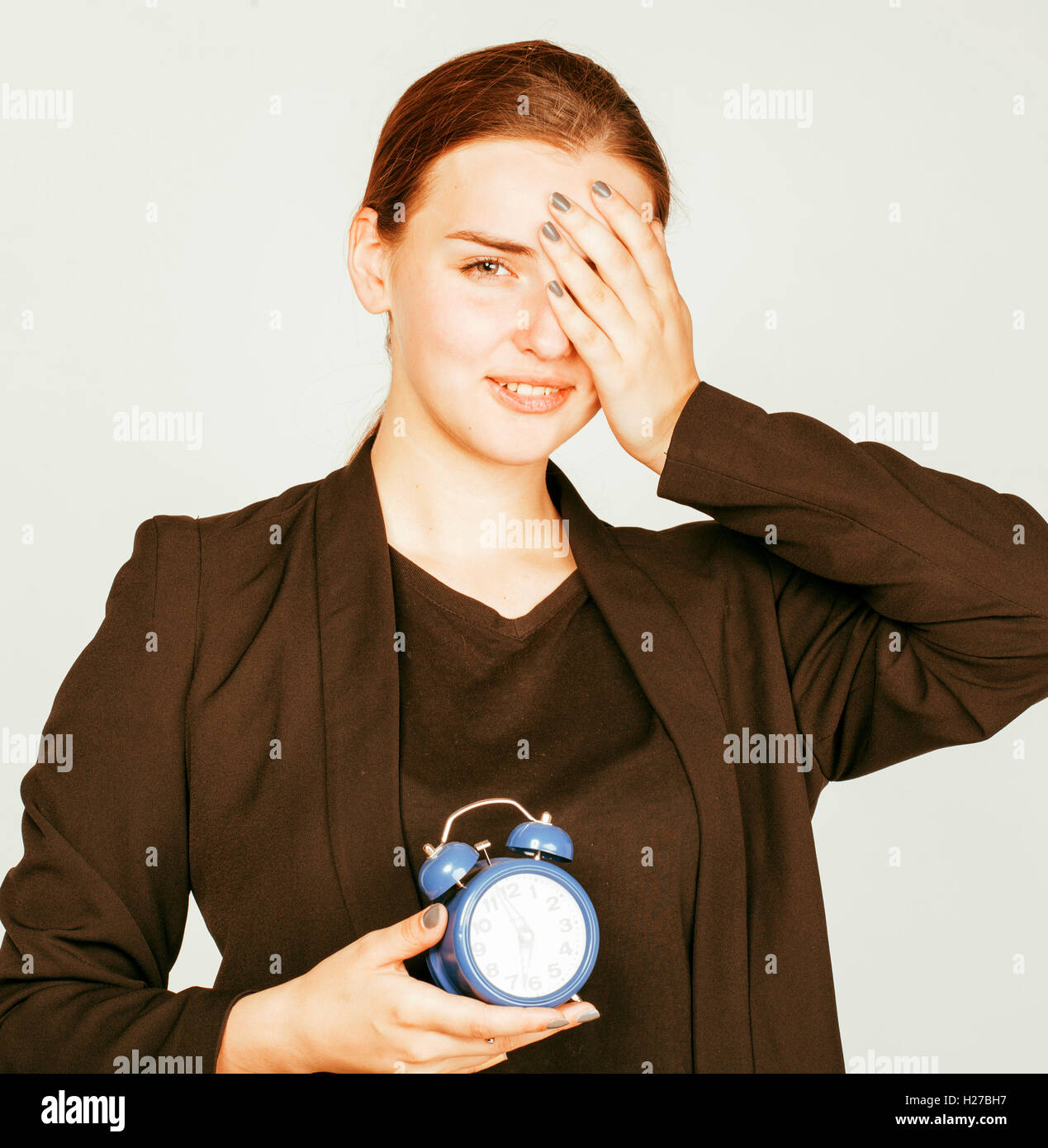 young beauty woman in business style costume waking up for work early ...