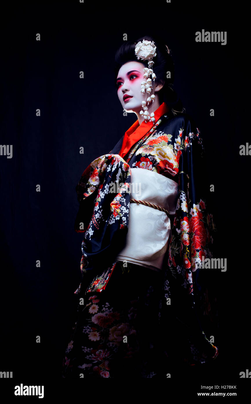 young pretty real geisha in kimono with sakura and decoration Stock ...