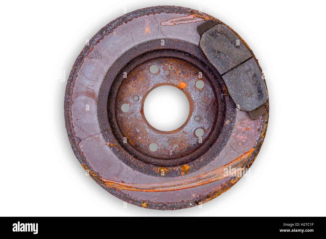 Old scored rusty brake rotor and pads or callipers removed from a car ...