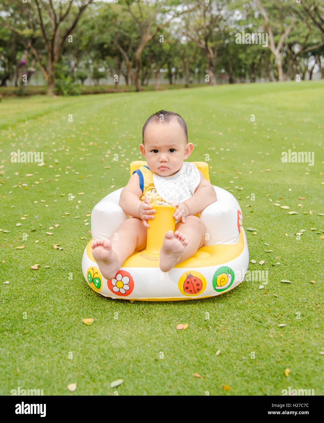 Closeup baby feet when sitting on the baby seat Stock Photo - Alamy