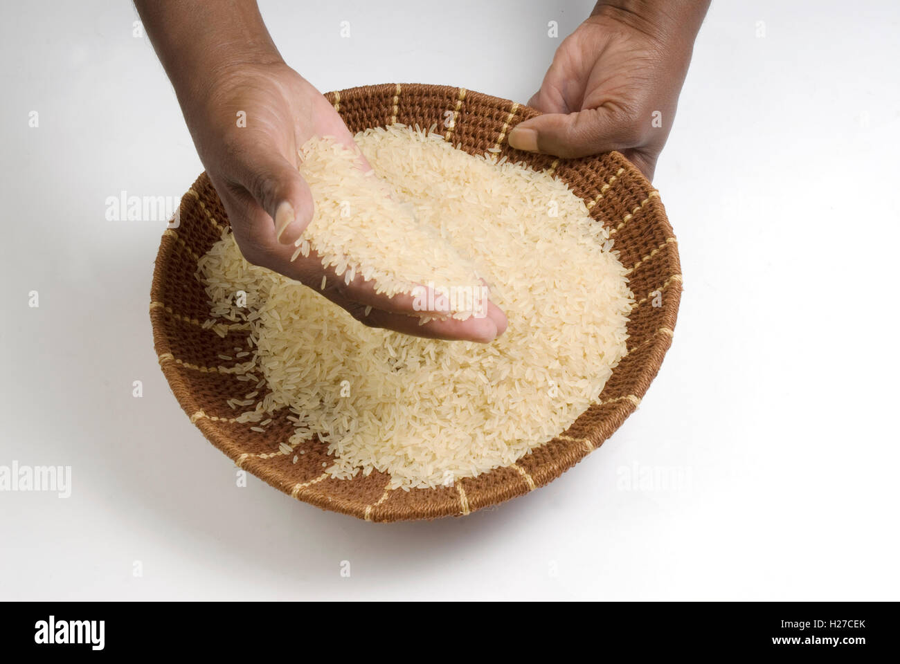 Hand pouring rice hi-res stock photography and images - Alamy