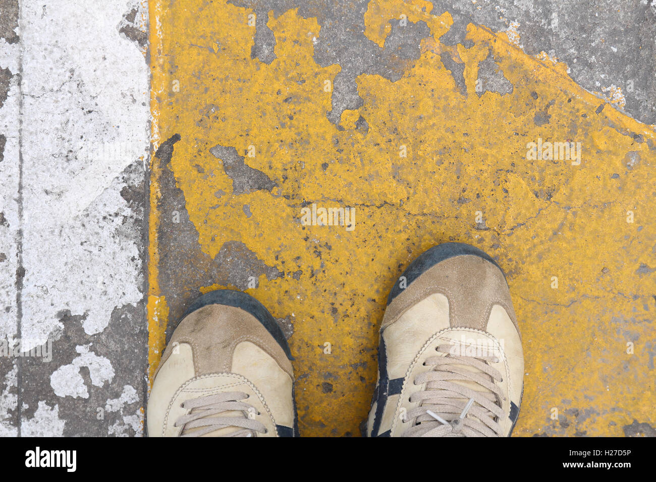 old shoes dirty on street color background Stock Photo - Alamy