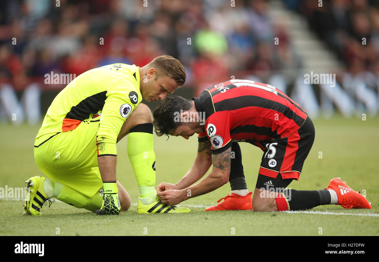 AFC Bournemouth's Adam Smith (right) ties AFC Bournemouth goalkeeper ...