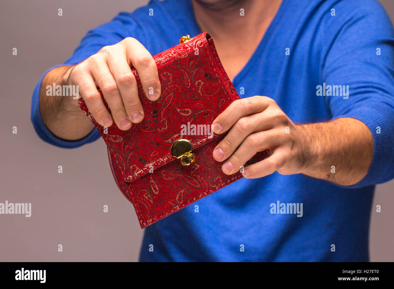 Modern blue bag in male hands Stock Photo - Alamy