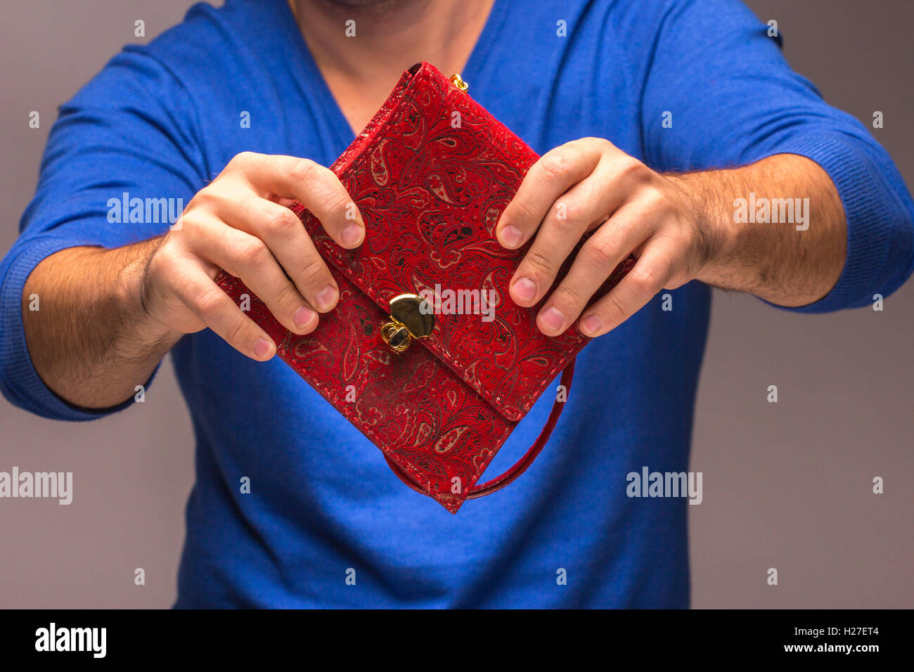 Modern blue bag in male hands Stock Photo - Alamy