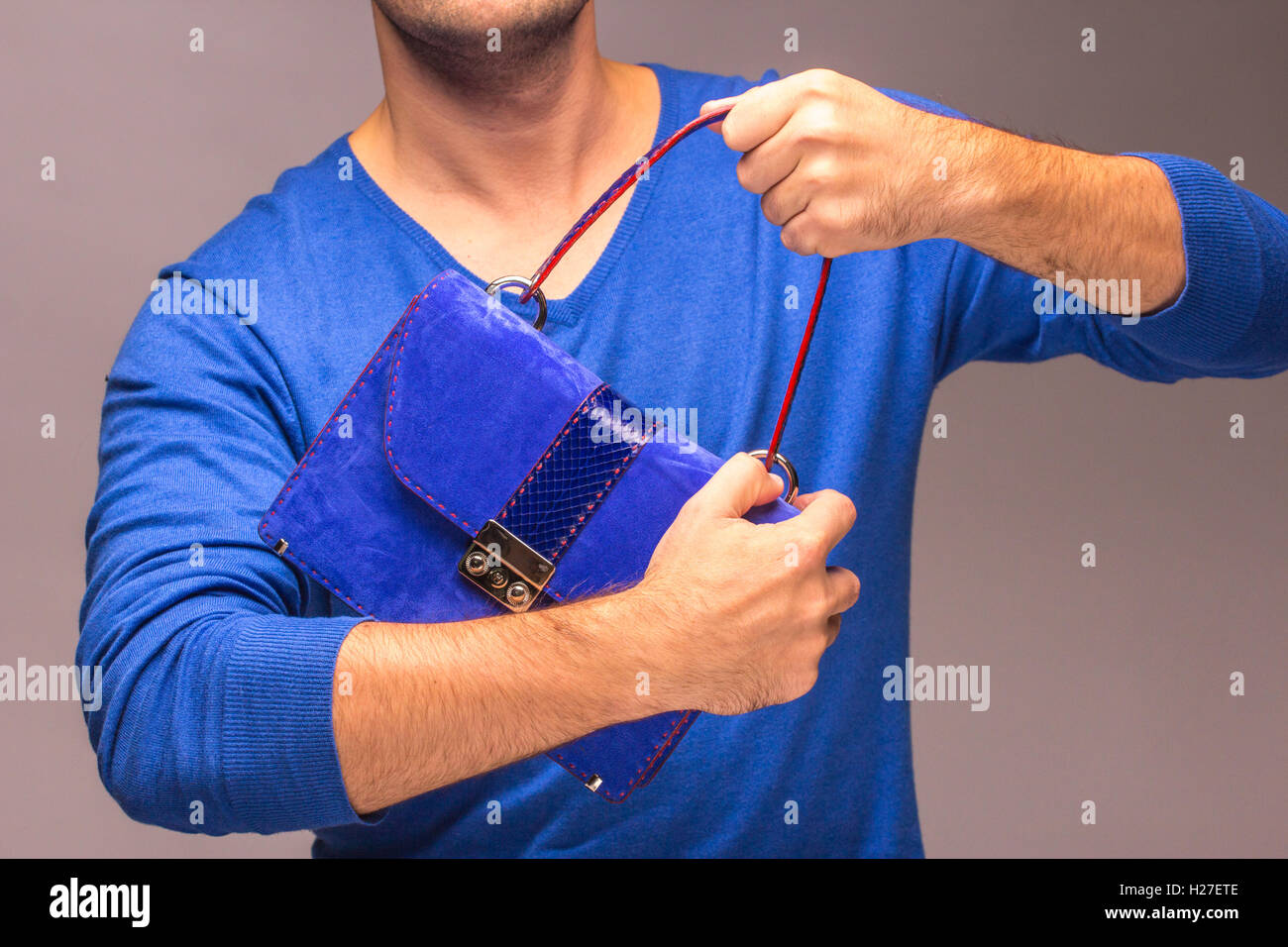 Modern blue bag in male hands Stock Photo - Alamy