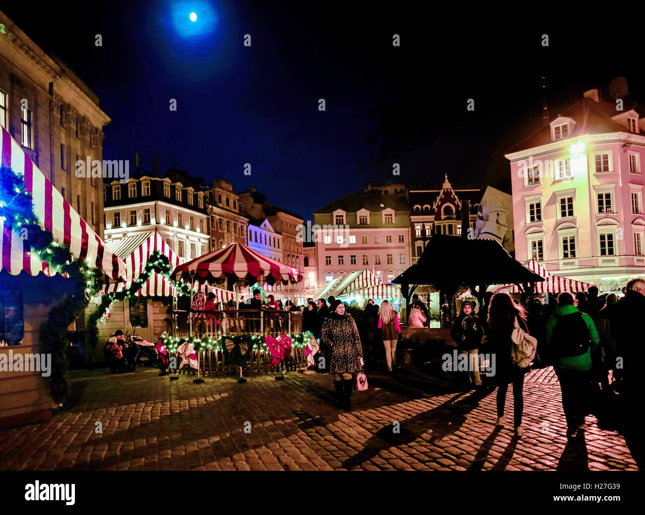 Riga, Latvia - December 24, 2015: People walking at the Christmas ...