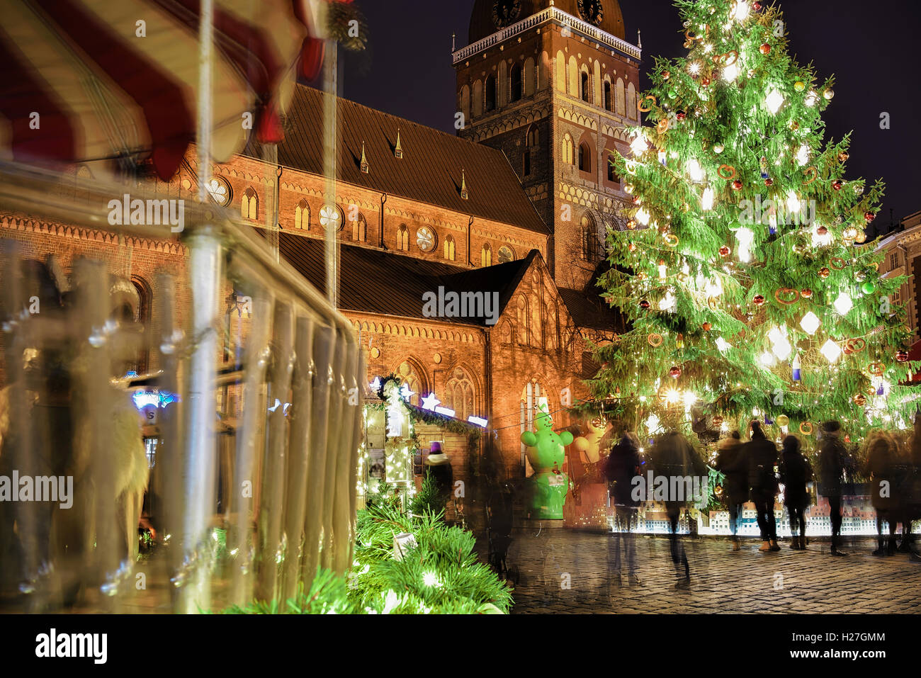 Carousel and Christmas tree at festive Christmas market in the Dome ...