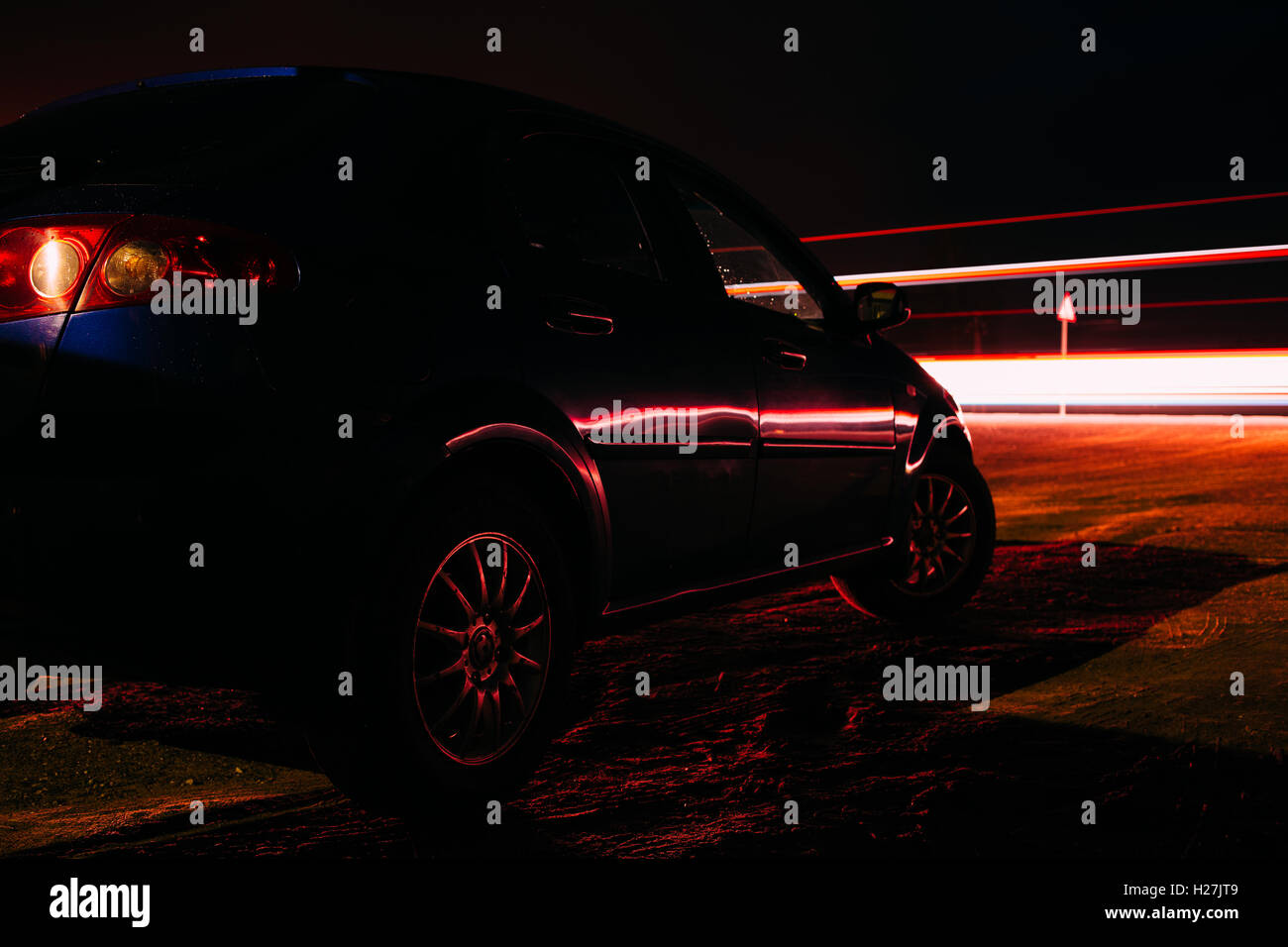 Car near the highway at night Stock Photo - Alamy