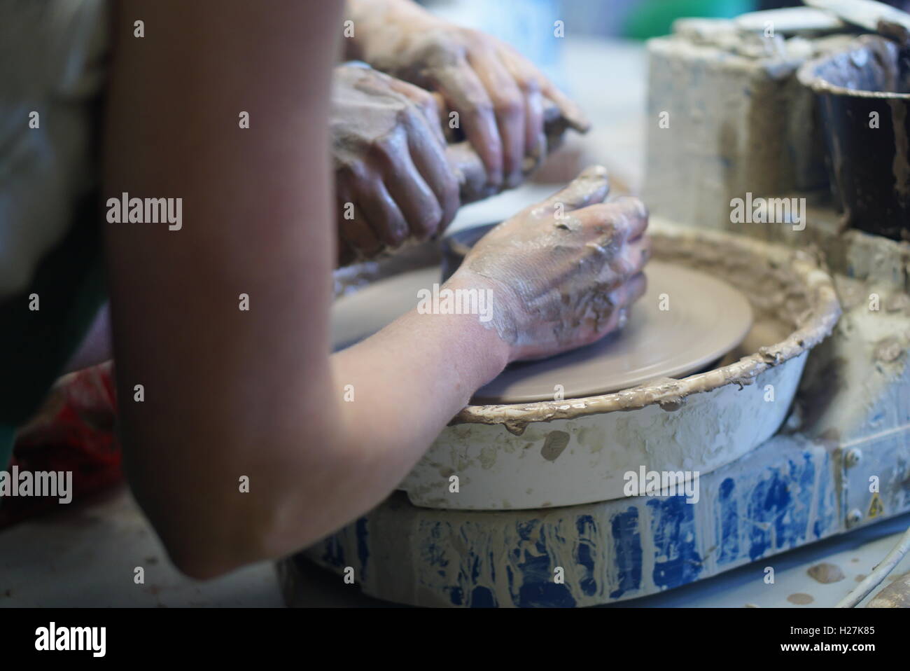 A close up of a mature student and tutor during pottery tutorial Stock ...